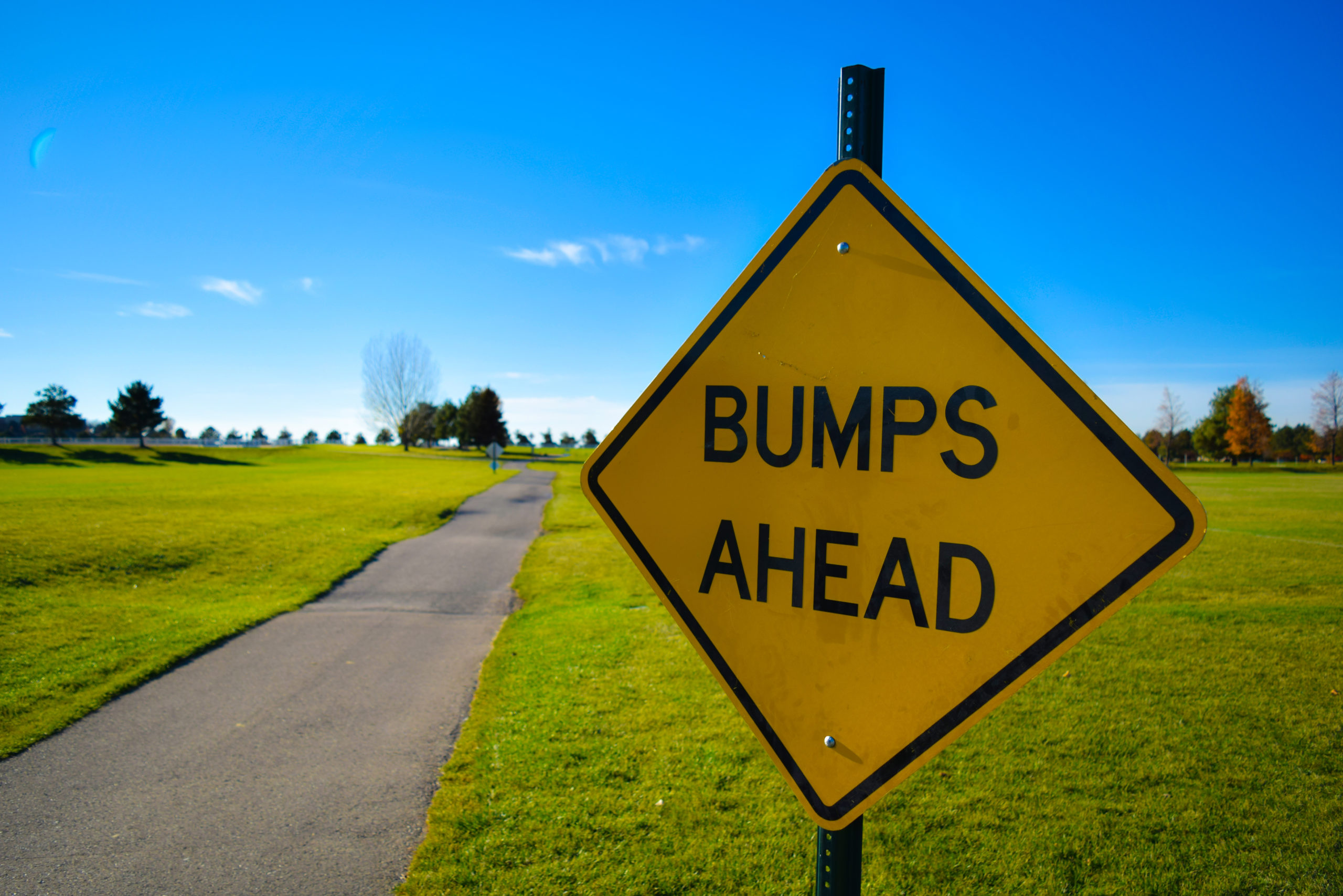 Bumps Ahead Sign Near Paved Path